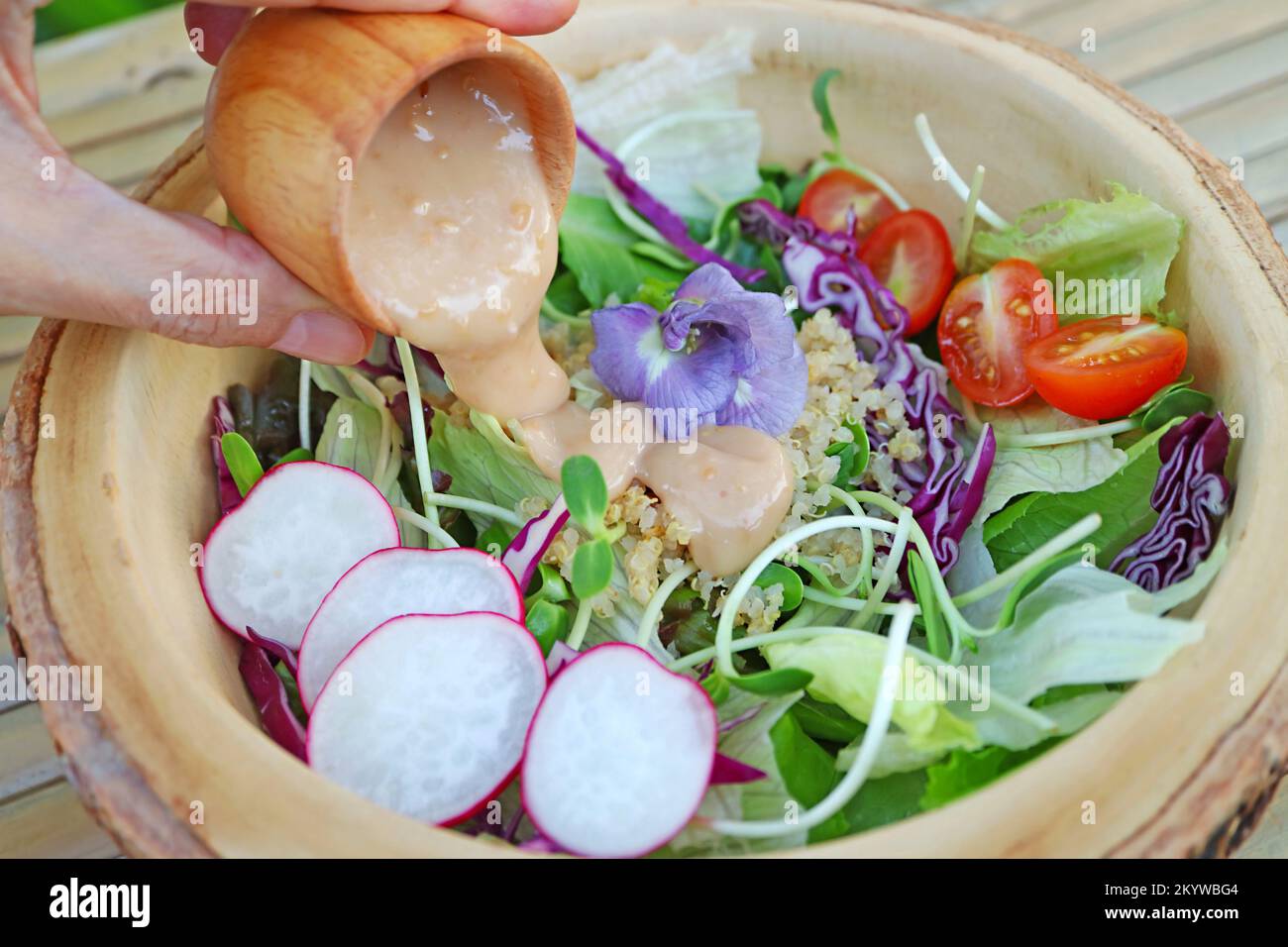 Closeup of Delectable Salad Dressing Being Added on Quinoa and ...