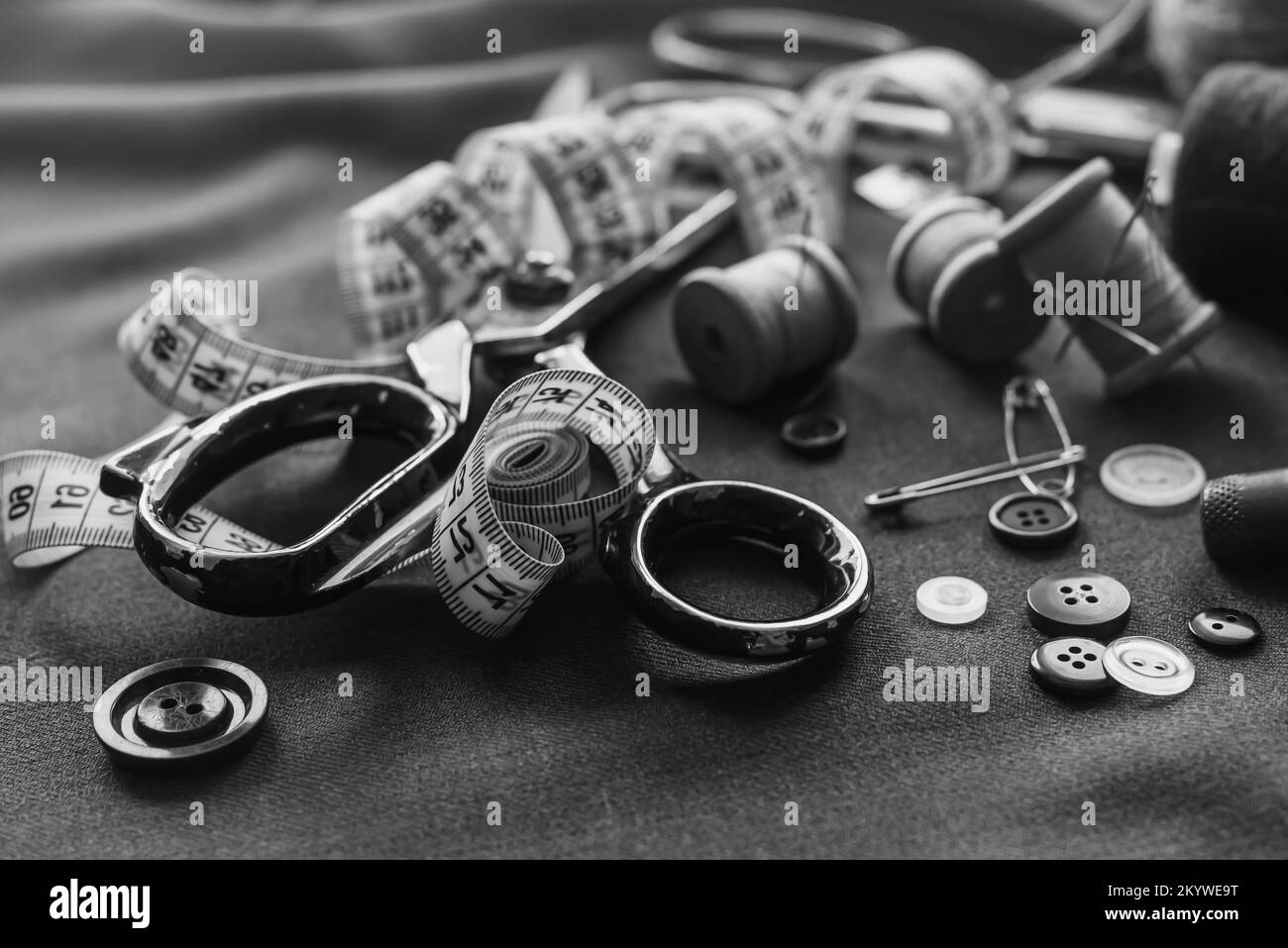 Retro tools for cutting and sewing. Needle with thread, thimble, sewing ...