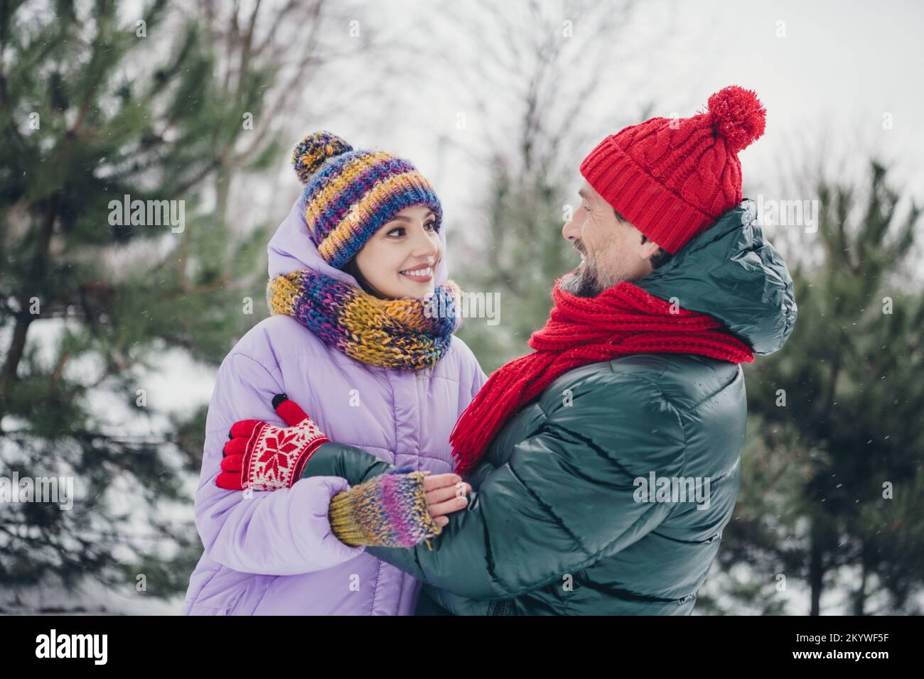 Photo of excited charming husband wife wear windbreaker cuddling ...