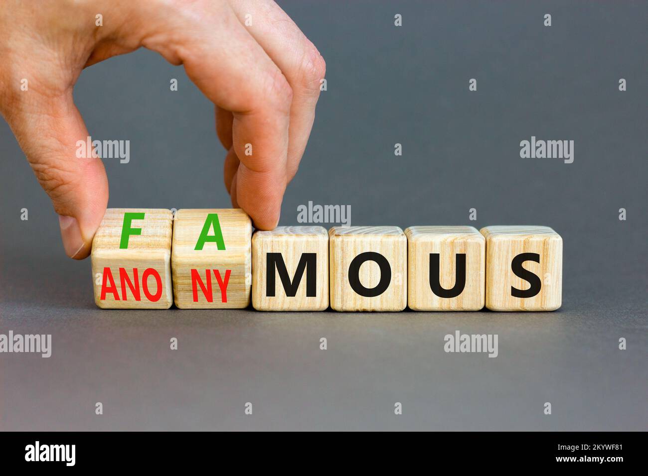 Famous or anonymous symbol. Concept word Famous and Anonymous on wooden ...