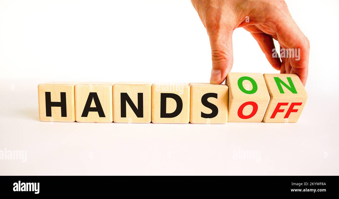 Hands on or off symbol. Concept words Hands on Hands off on wooden cubes. Businessman hand ...
