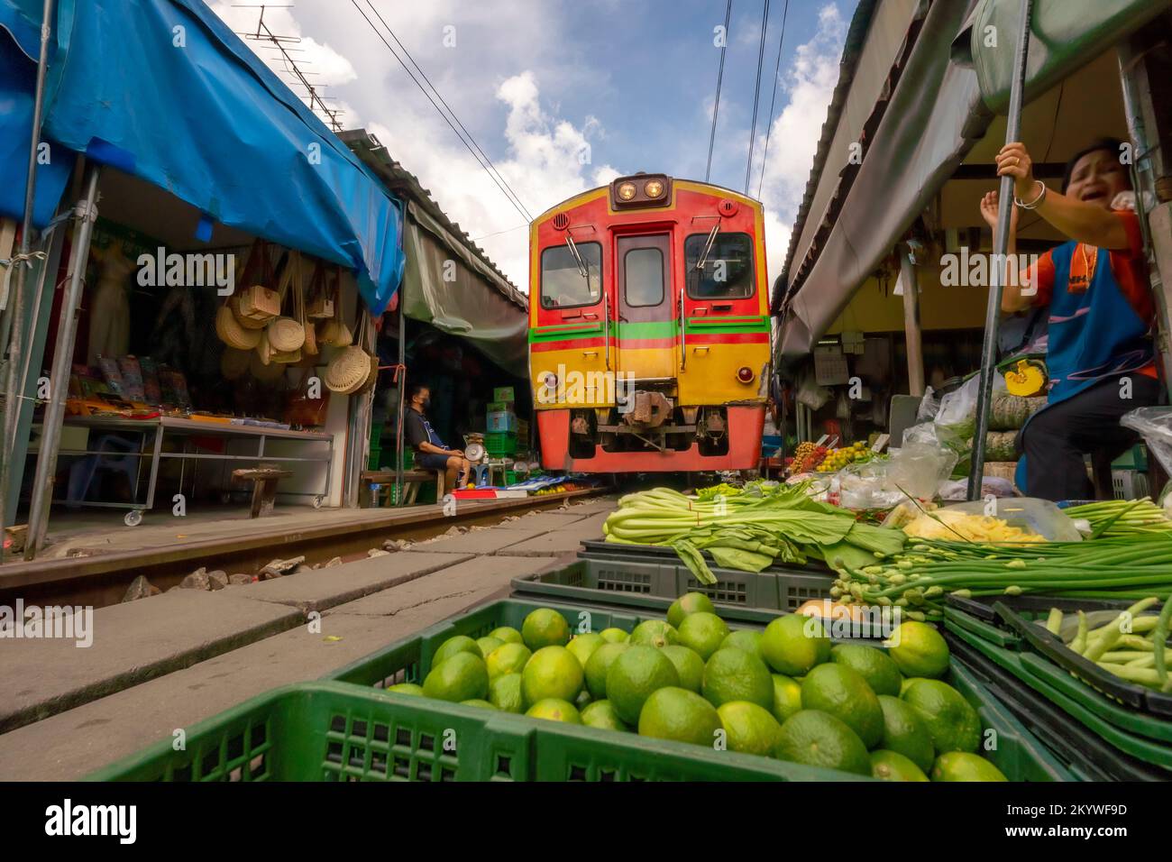 Rom Hoop umbrella market. Thai Railway with a local train run through ...