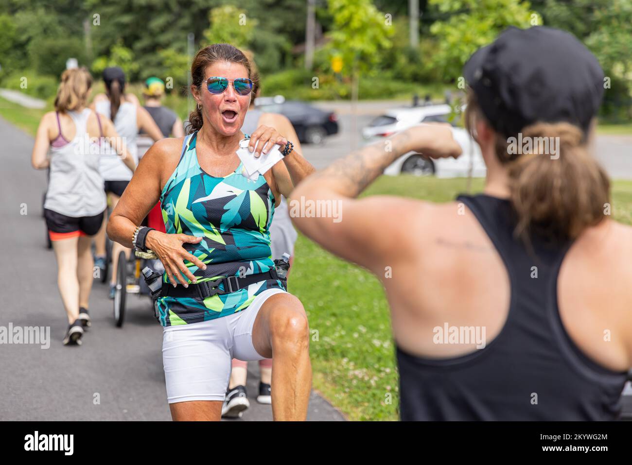 Selective focus of colorful female instructor who is giving cardio ...