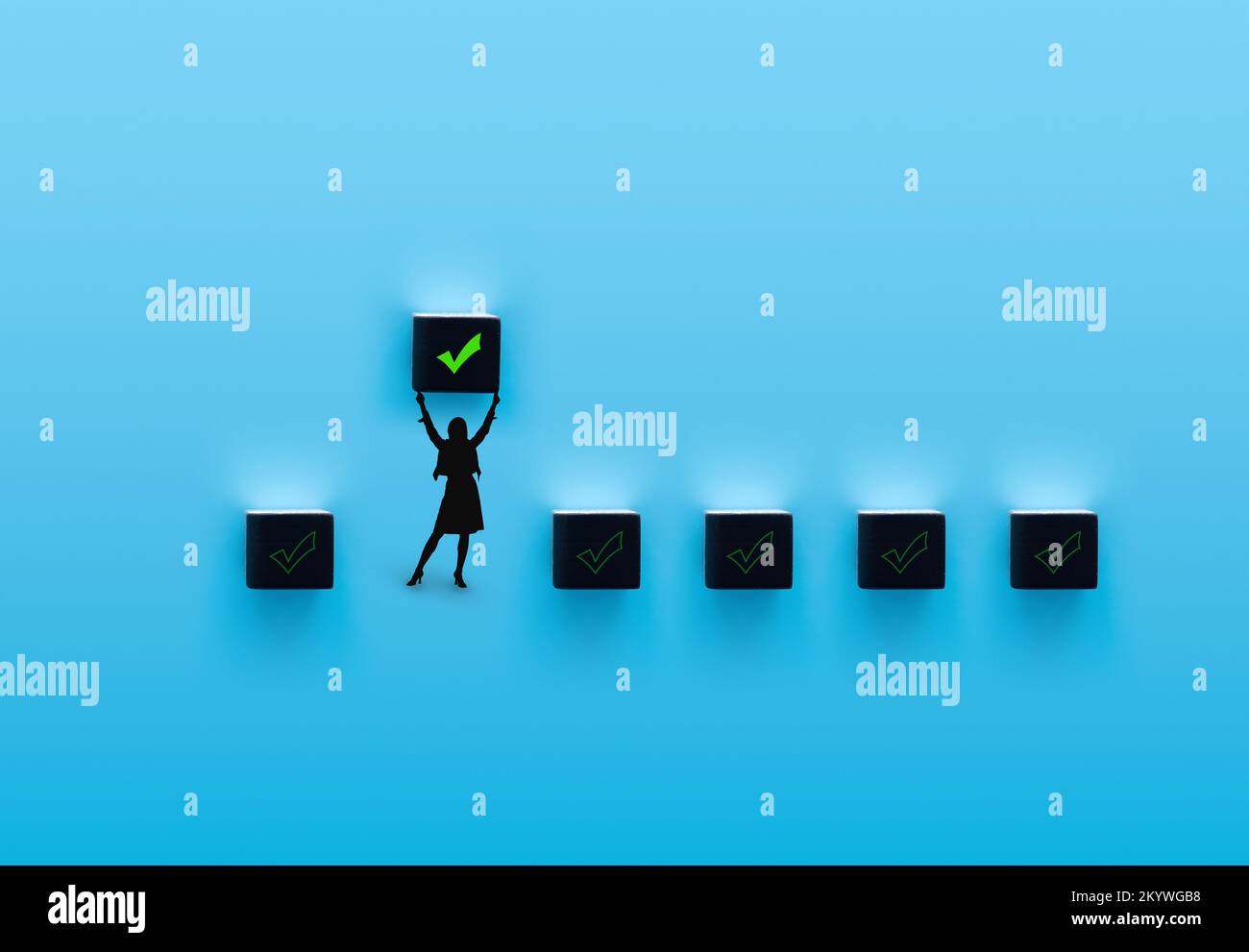 A person holding a cube with an approval mark between the cubes Stock ...