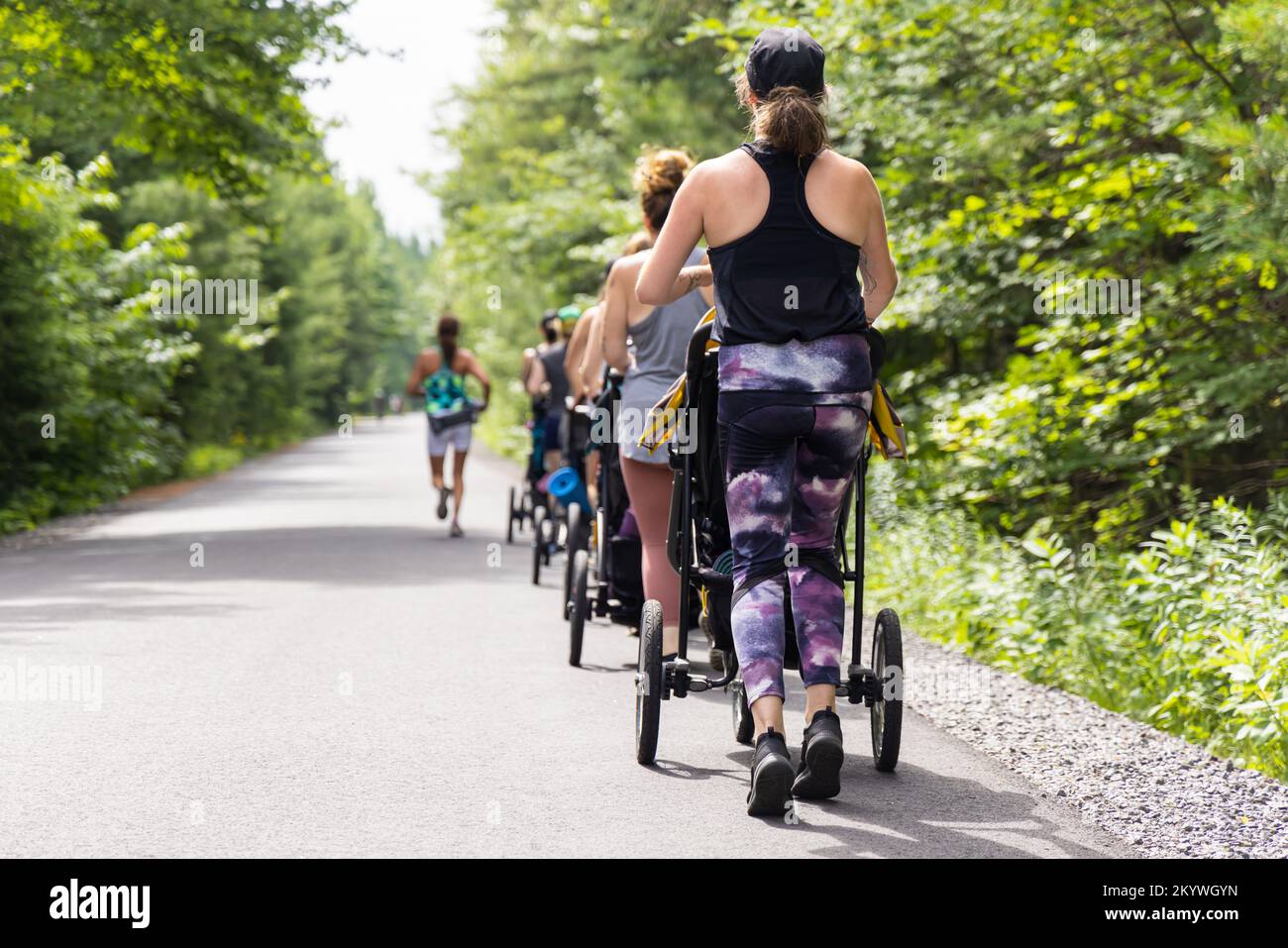 Wide angle shot of mothers walking together in group session and ...