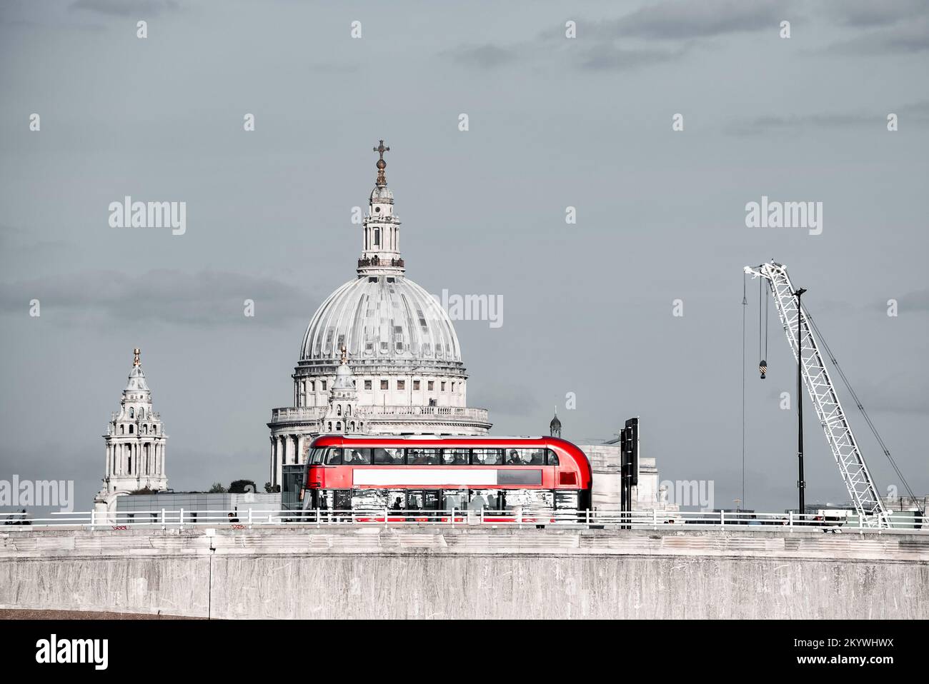 Red double decker bus crossing a bridge in London, England Stock Photo ...