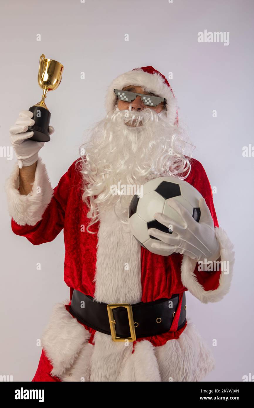 santa claus with sunglasses "thug life" soccer ball and a trophy in his ...