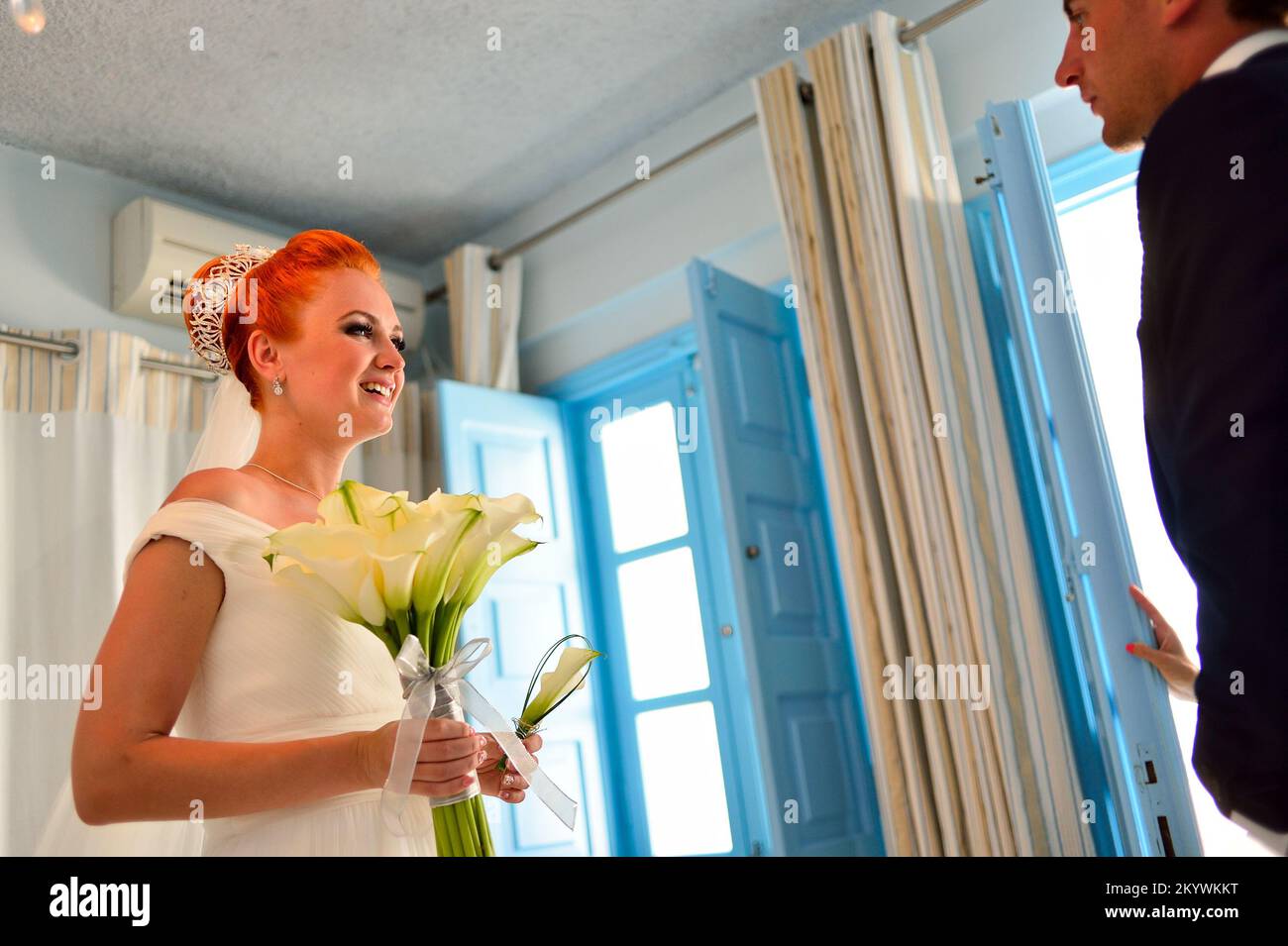 Beautiful young bride preparing for celebration wedding on Santorini ...