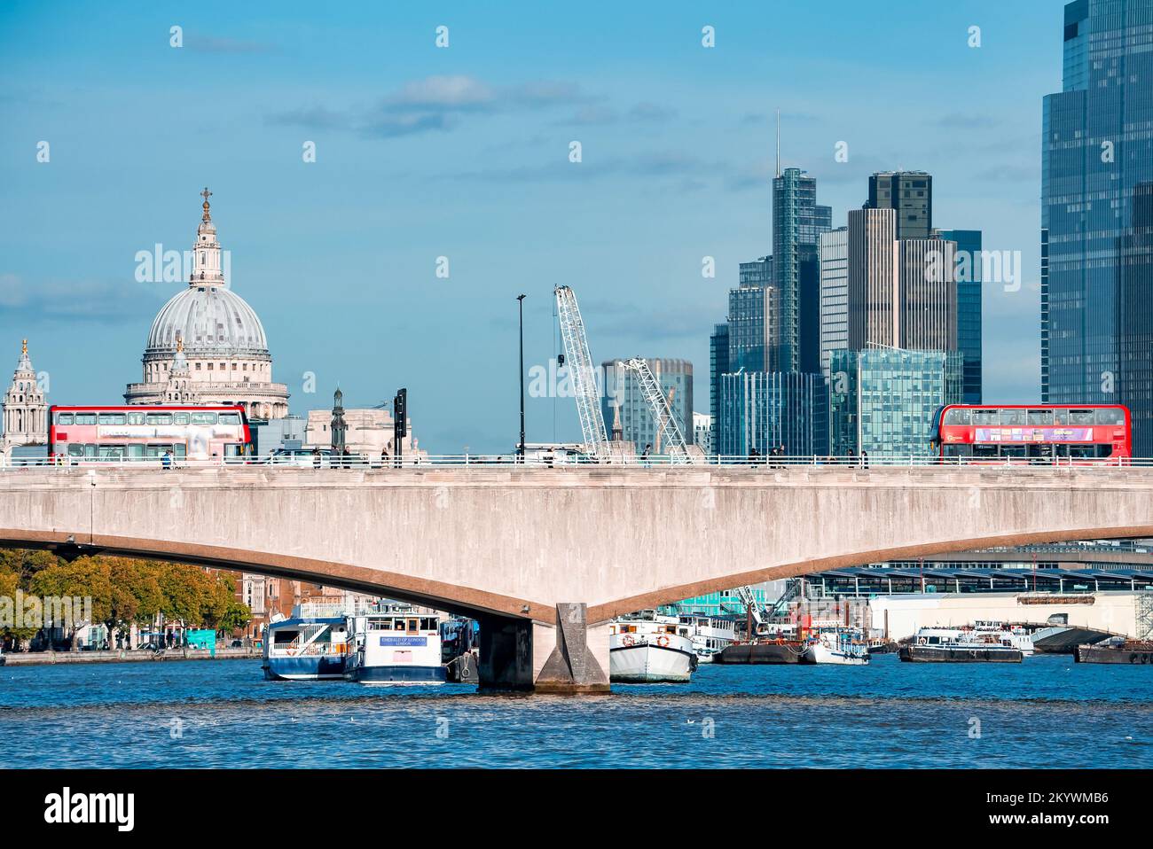 Red double decker bus crossing a bridge in London Stock Photo - Alamy