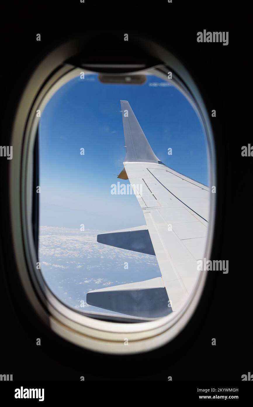View from Inside an Aircraft: Window of the Cabin, White Airplane Wing ...