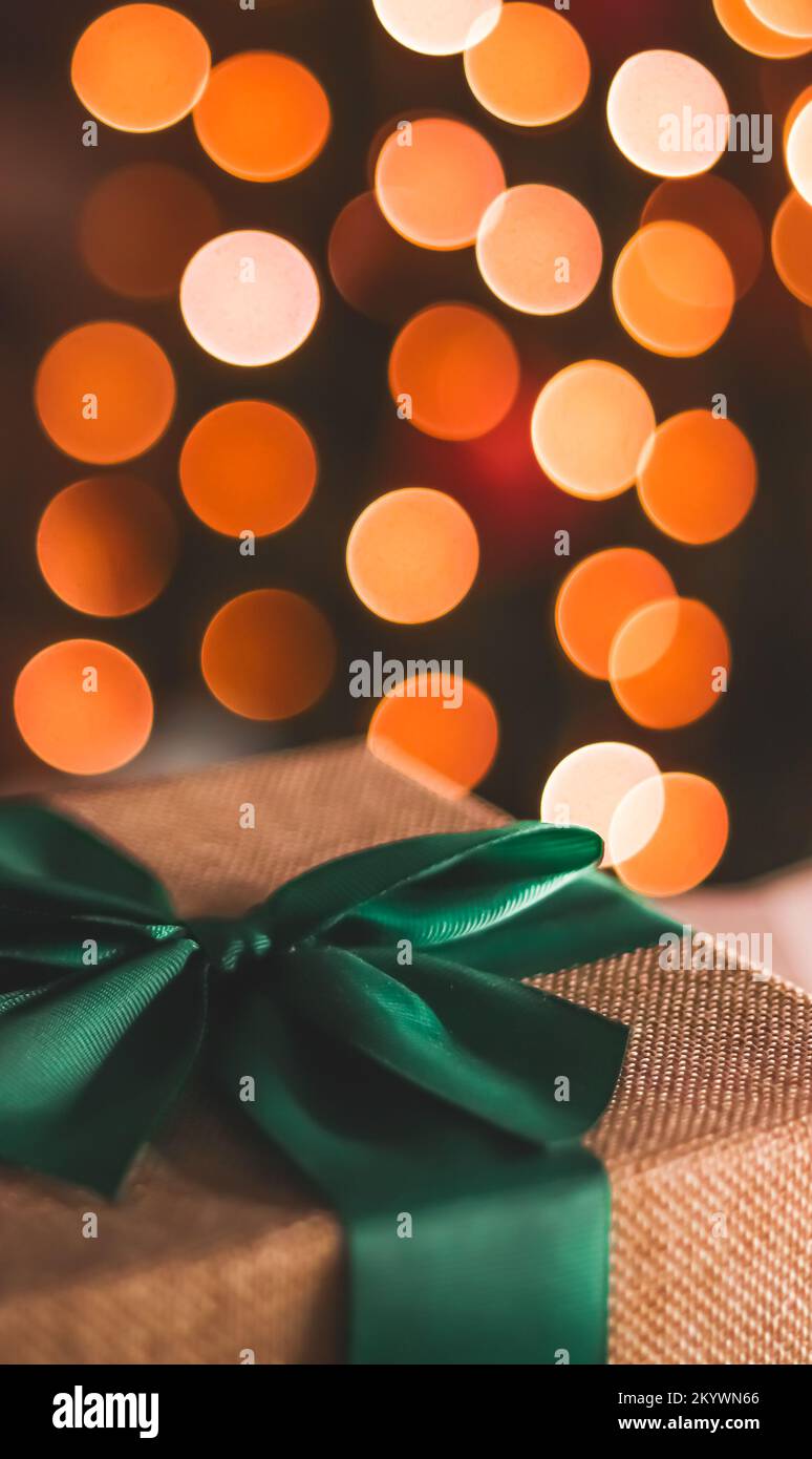 Holiday mood and festive atmosphere, wrapped gift and Christmas tree ...