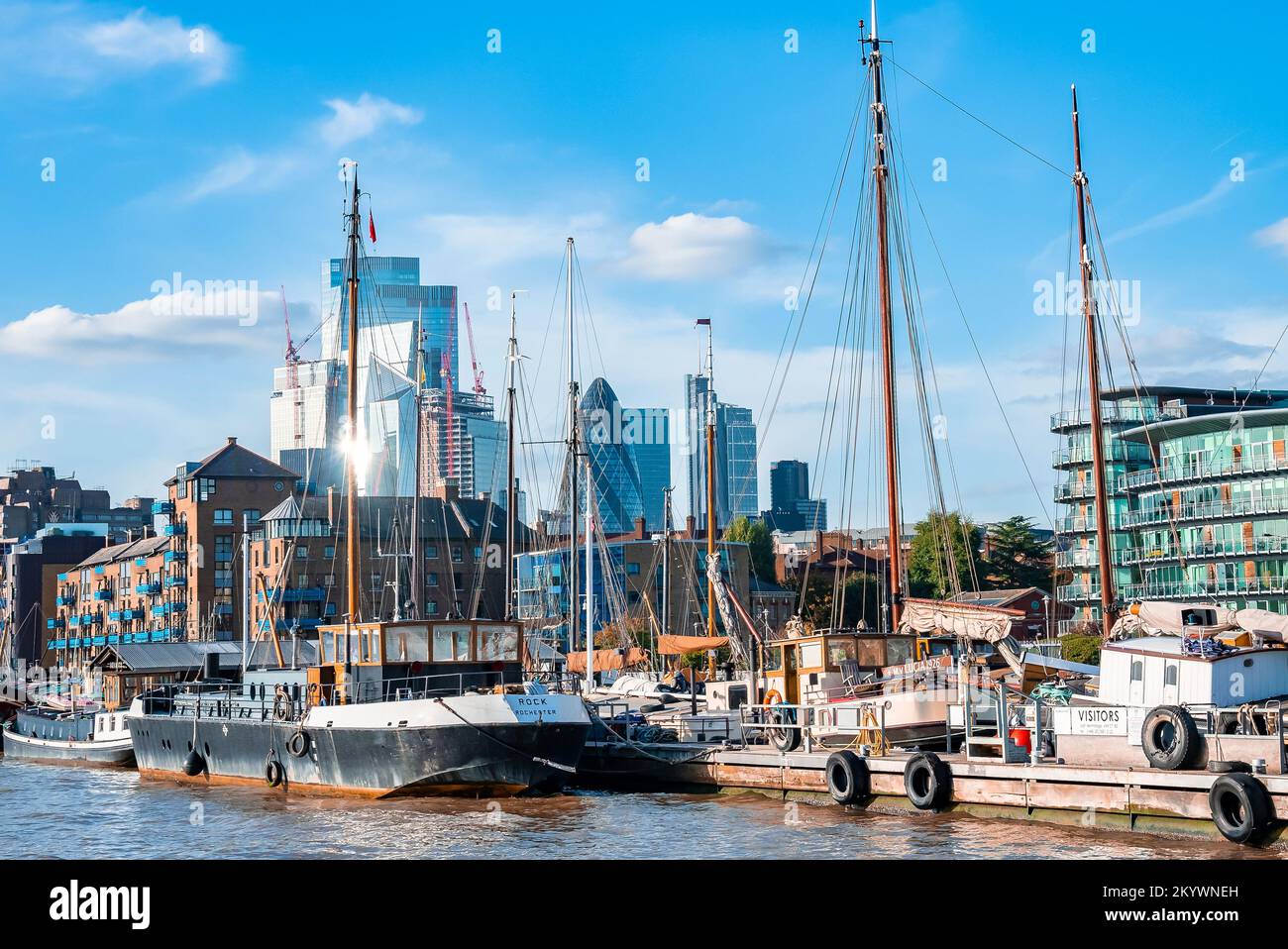 Boats and small ships docked on a river Thames in London, UK Stock ...