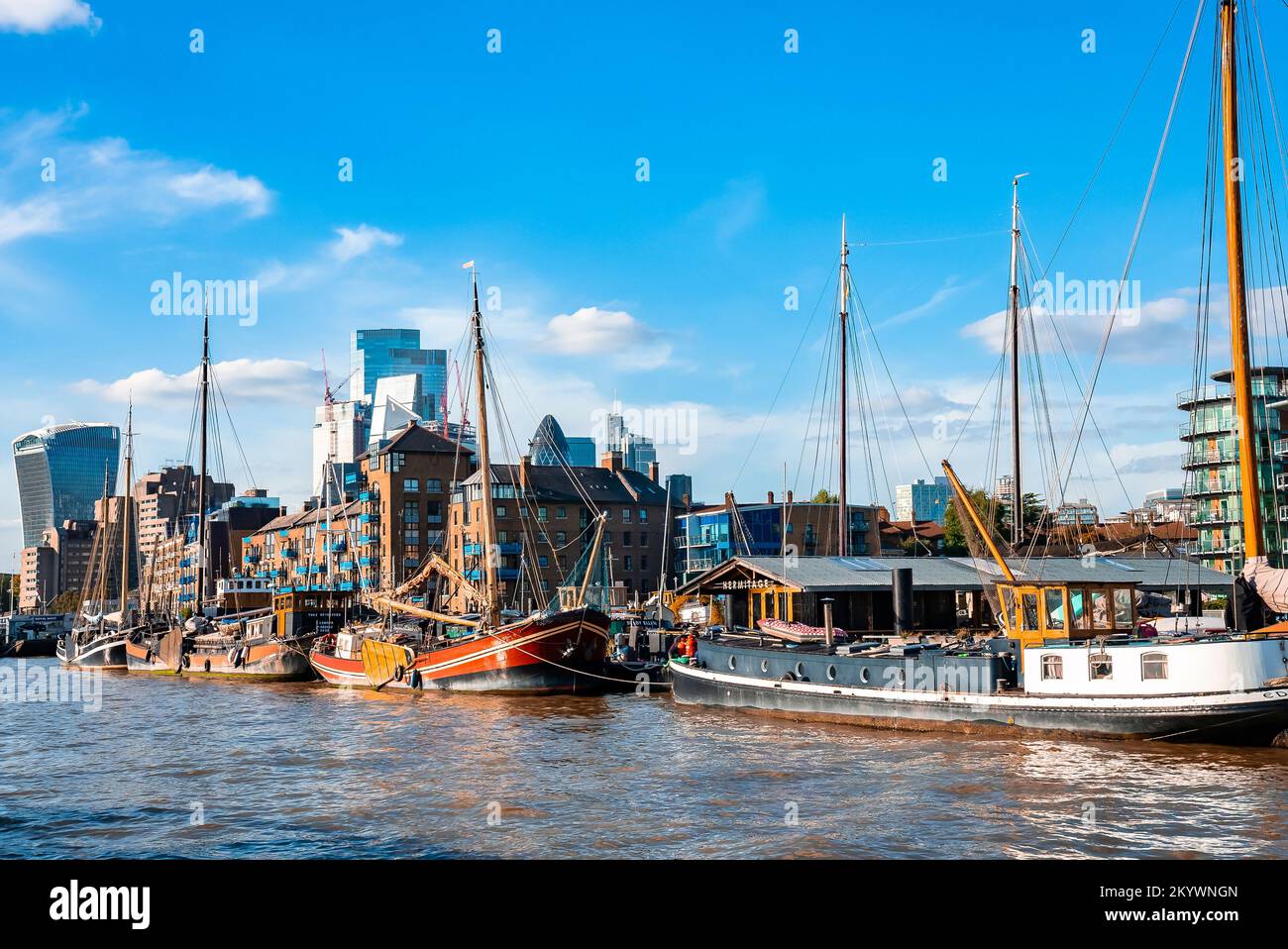 Boats and small ships docked on a river Thames in London, UK Stock ...