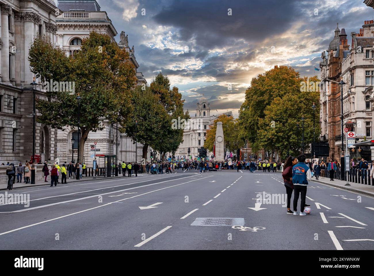 Protestors with arms locked in tubes surrounded by the police Stock ...