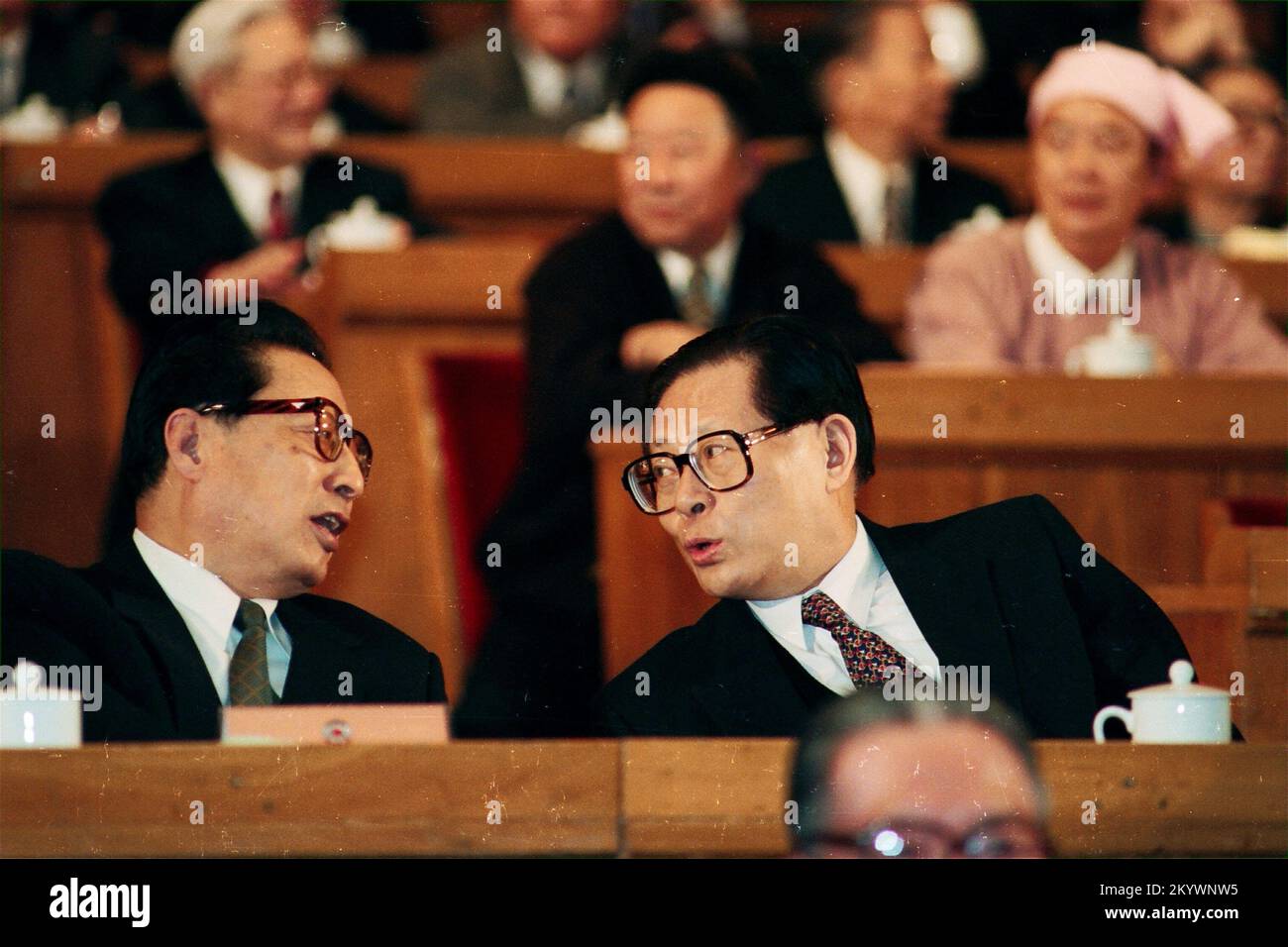 Qiao Shi (left), Chairman of the National People's Congress, chats with ...