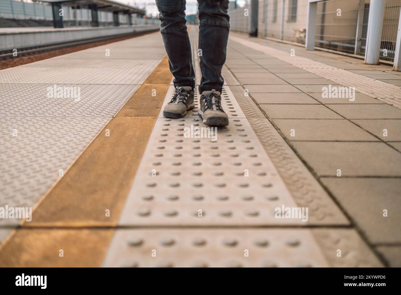 Cropped photo of male waiting subway train on platform Stock Photo - Alamy
