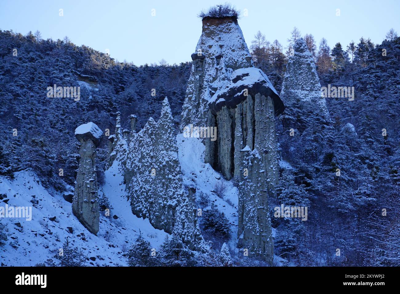 view of the Demoiselles Coiffées rock formation in Serre Ponçon lake ...