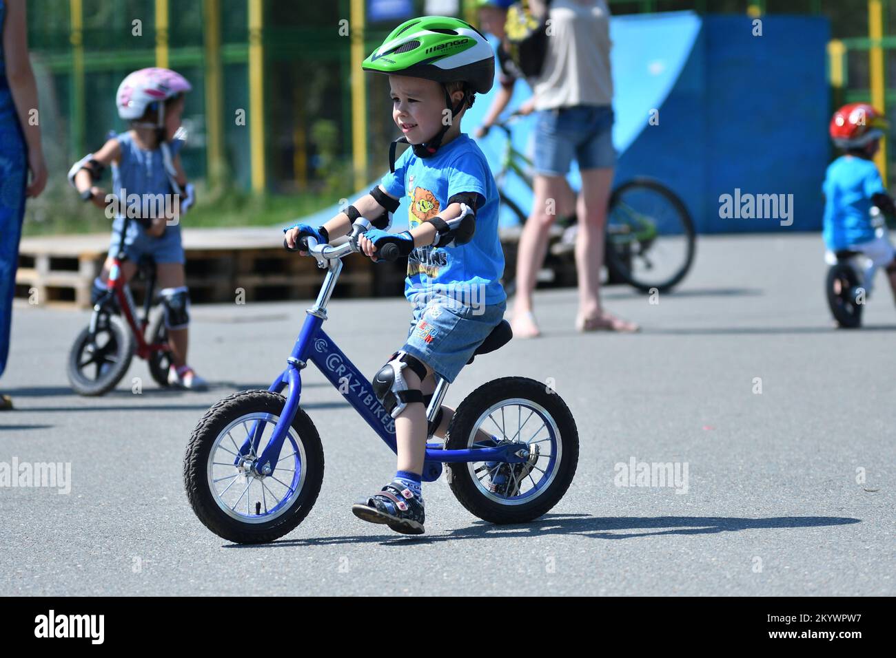 Orenburg, Russia - July 29, 2017 year: little kids learn to ride on Begovel im Club "MINI BIKE ...