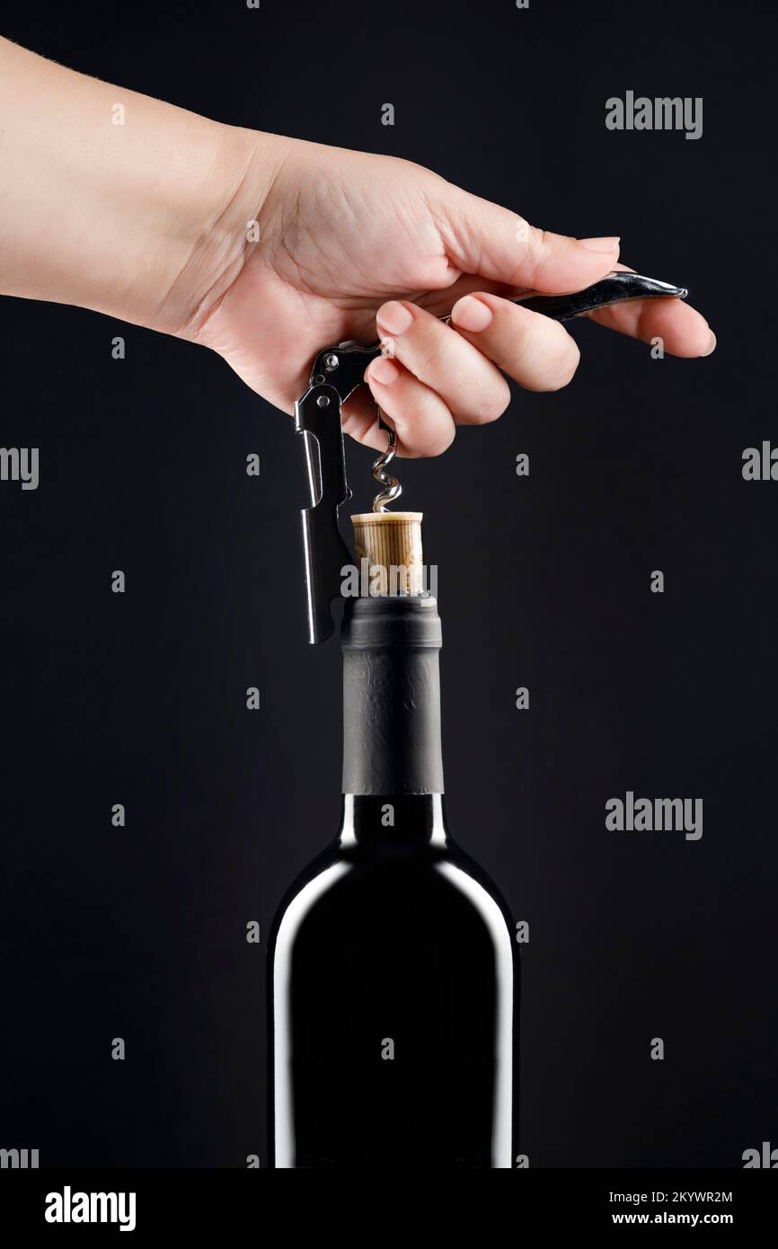 Hand uncorking bottle of wine Stock Photo - Alamy Hand uncorking bottle of wine Stock Photo - Alamy