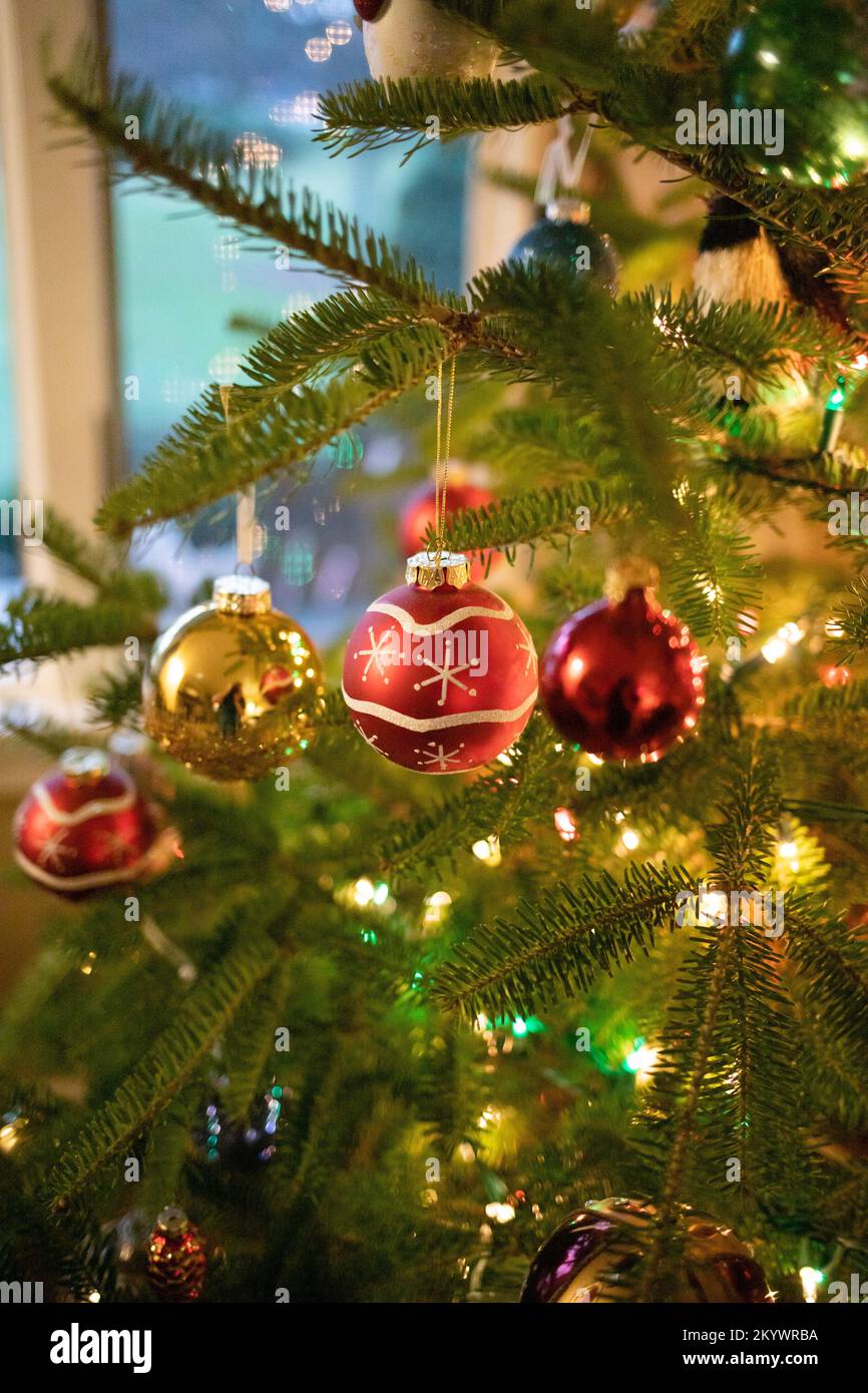 Vertical image of christmas ornaments hanging on christmas tree Stock ...
