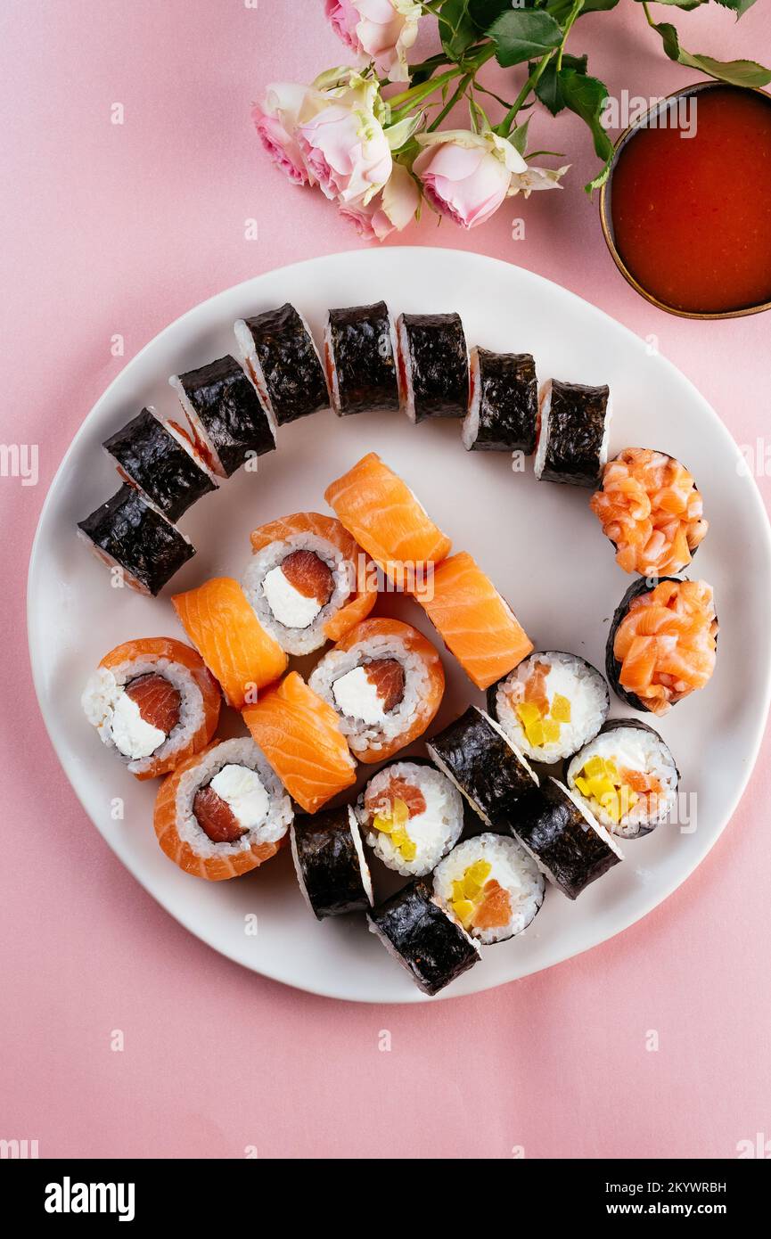 japanese sushi with salmon and props on the table Stock Photo - Alamy