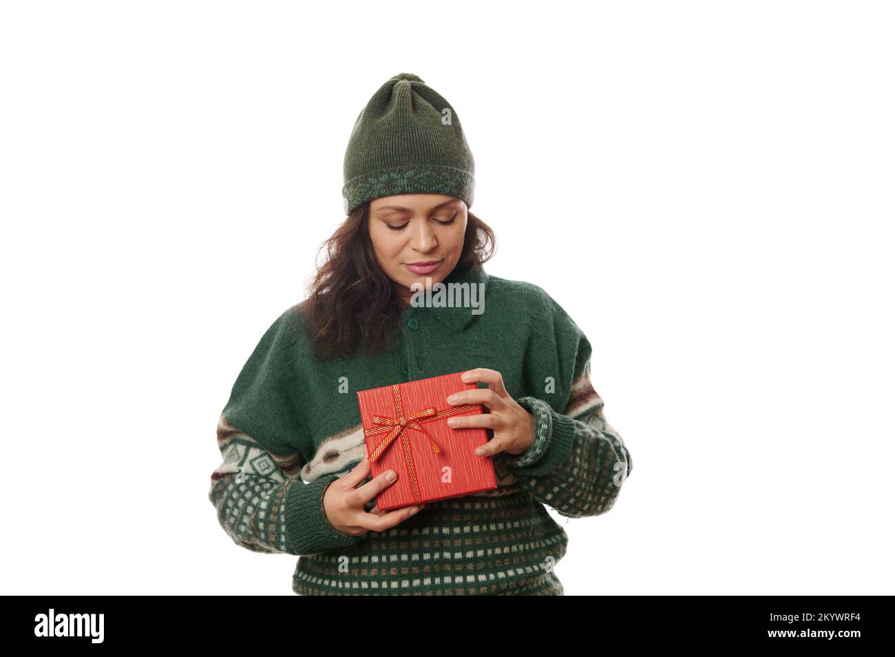 Beautiful Latin American woman in green warm wool Xmas sweater and hat ...