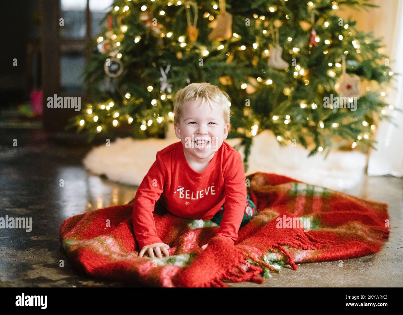 Cheerful boy in bright red hi-res stock photography and images - Alamy