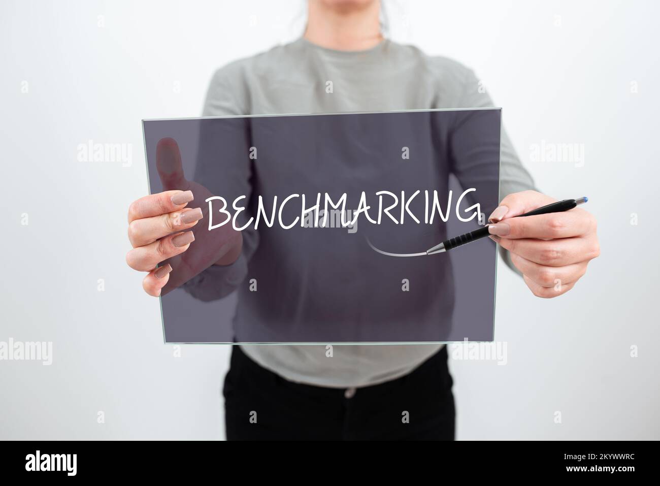 Hand writing sign Benchmarking. Word for Evaluate something by ...