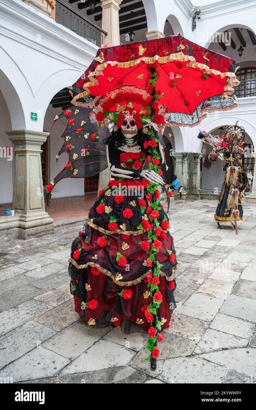 A person on stilts dressed as La Catrina for a costume competition for ...
