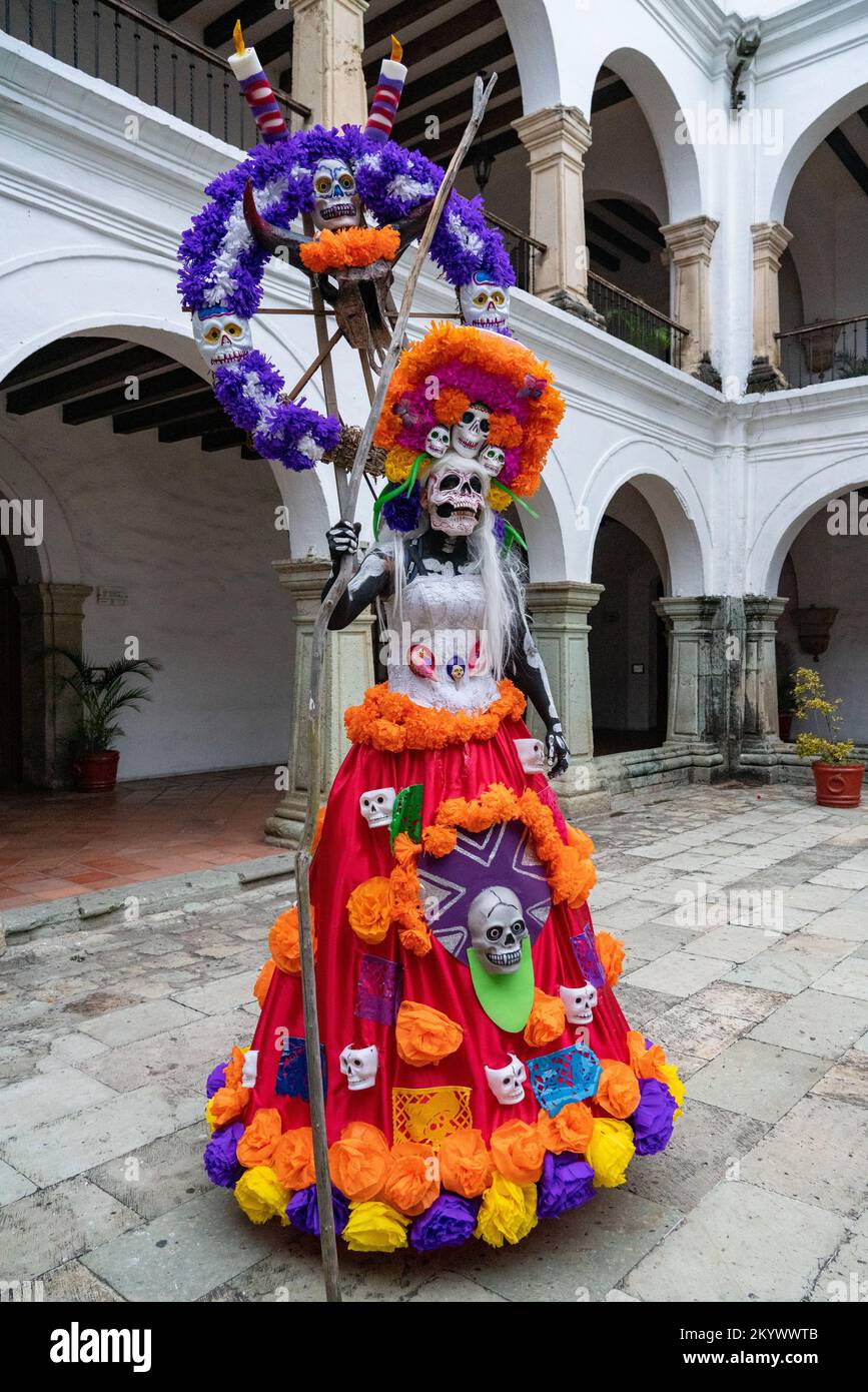 A person on stilts dressed as La Catrina for a costume competition for ...