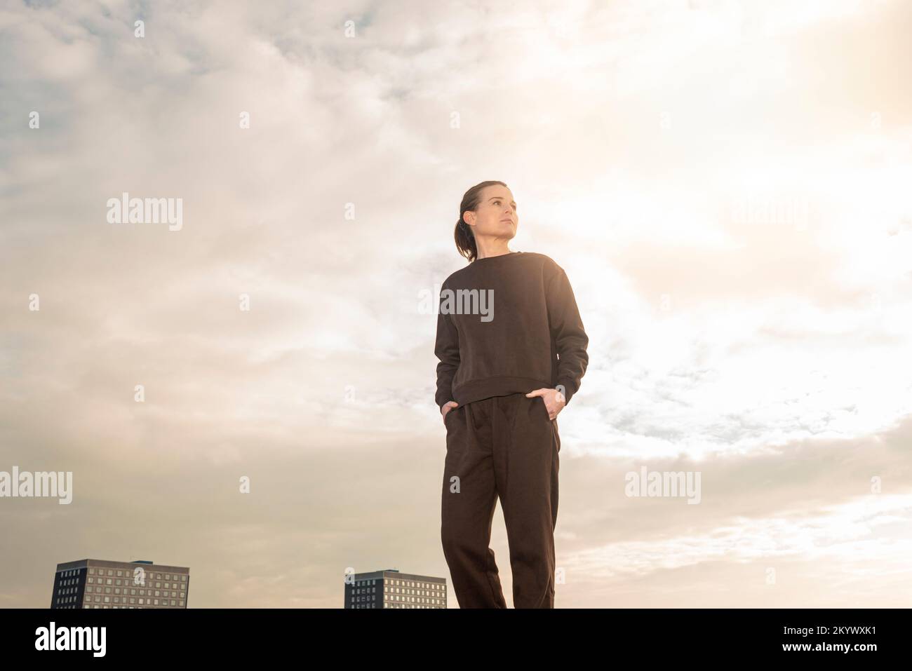 Fit sporty mid adult woman wearing a track suit outside. Preparing for ...