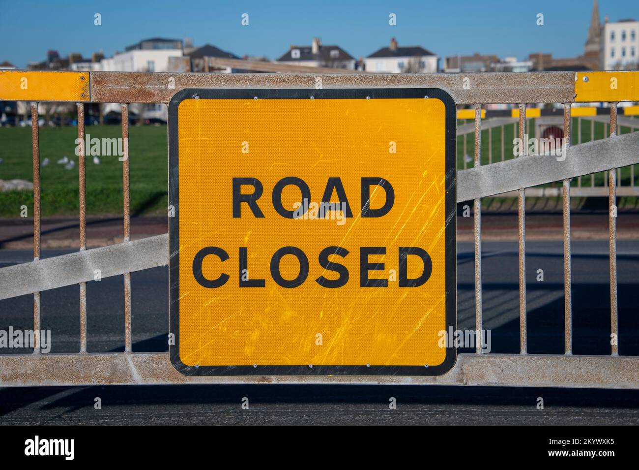 Orange road closed sign on a metal gate Stock Photo - Alamy