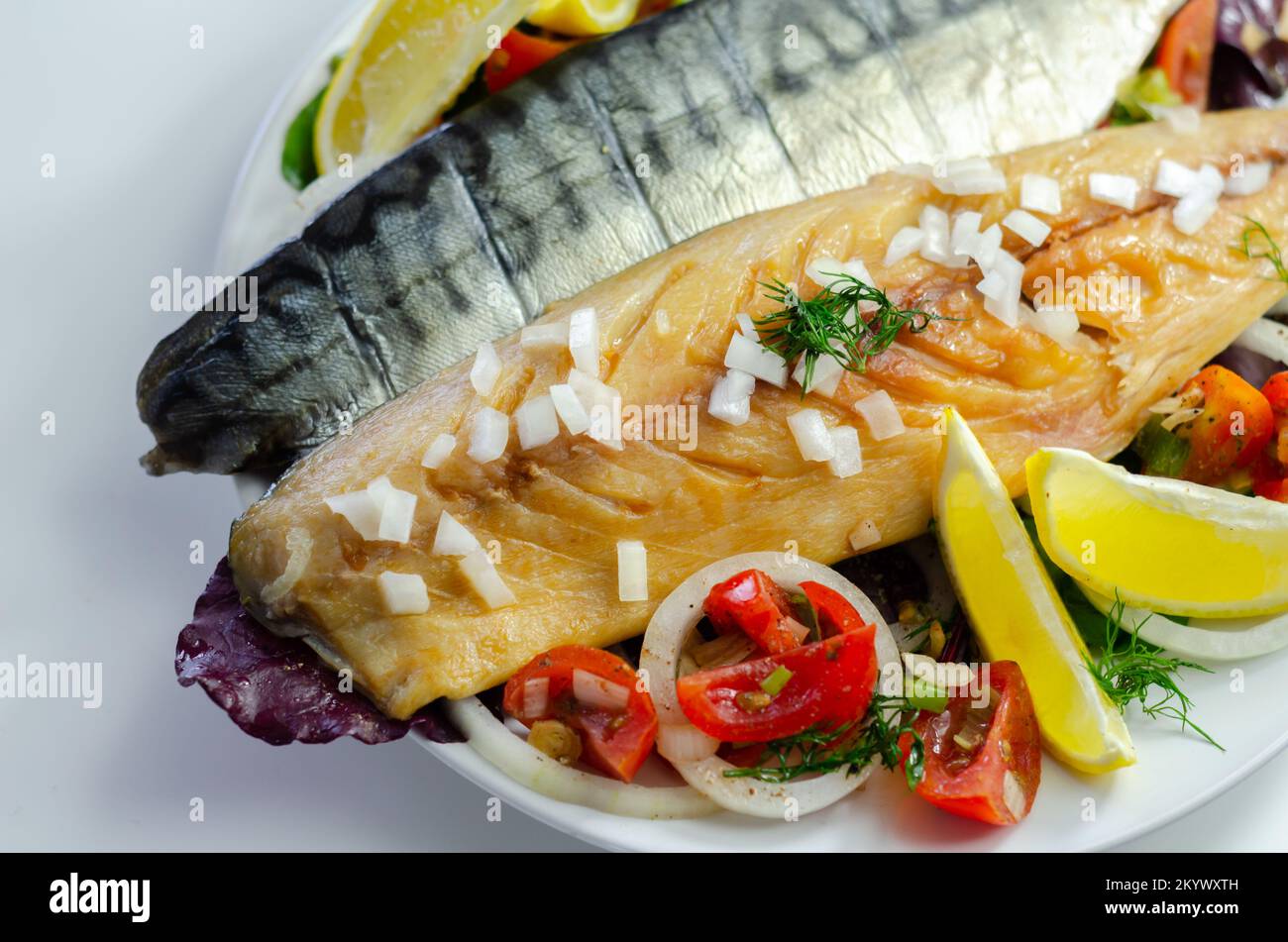 Hot smoked scottish mackerel fillets with onions, tomato and salad ...