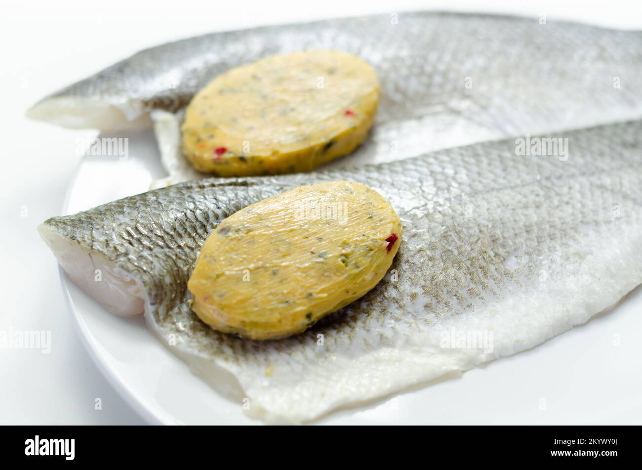Prepared for fry boneless sea bass fillets with a lemon and pepper ...