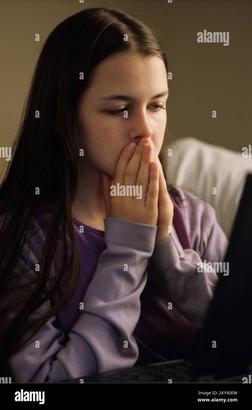 Young girl on computer when something horrible happens Stock Photo - Alamy