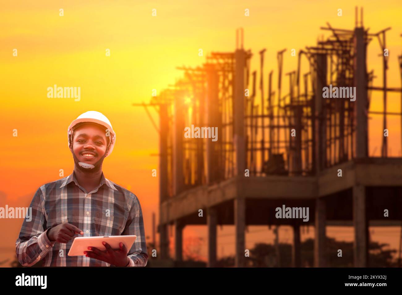 African Engineer man use tablet device standing communication at ...