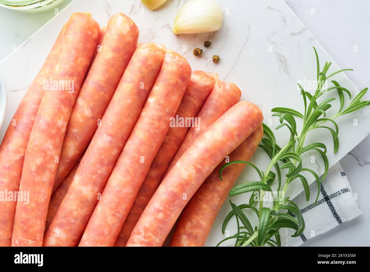 Meat beef sausages. Raw barbecue sausages with spices, vegetables and ...