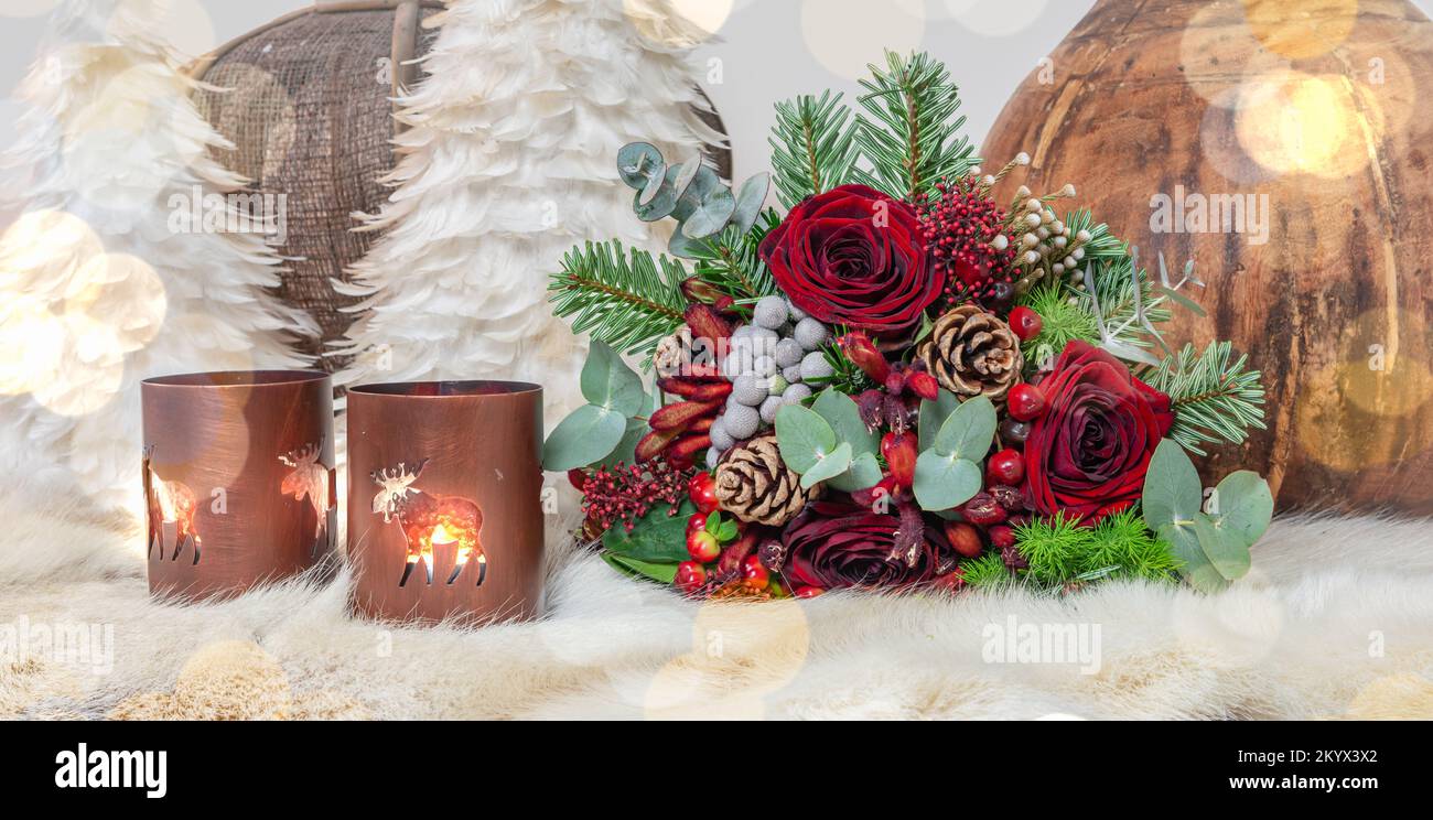 Christmas still life with bouquet, candles and decorations Stock Photo ...