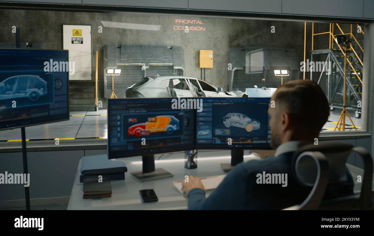 An Engineer In A Crash Test Lab Uses A Car Crash Test System To