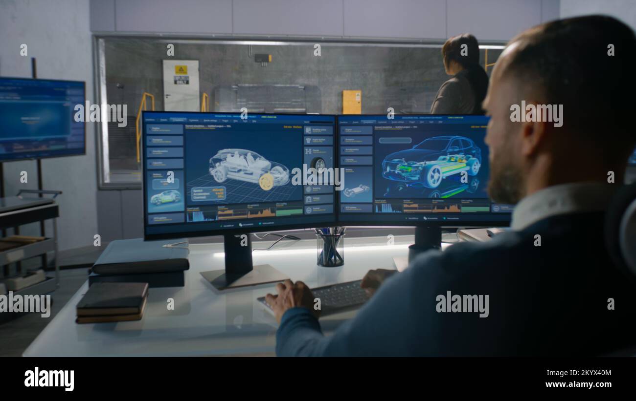 Female and male engineers in experimental crash test laboratory ...