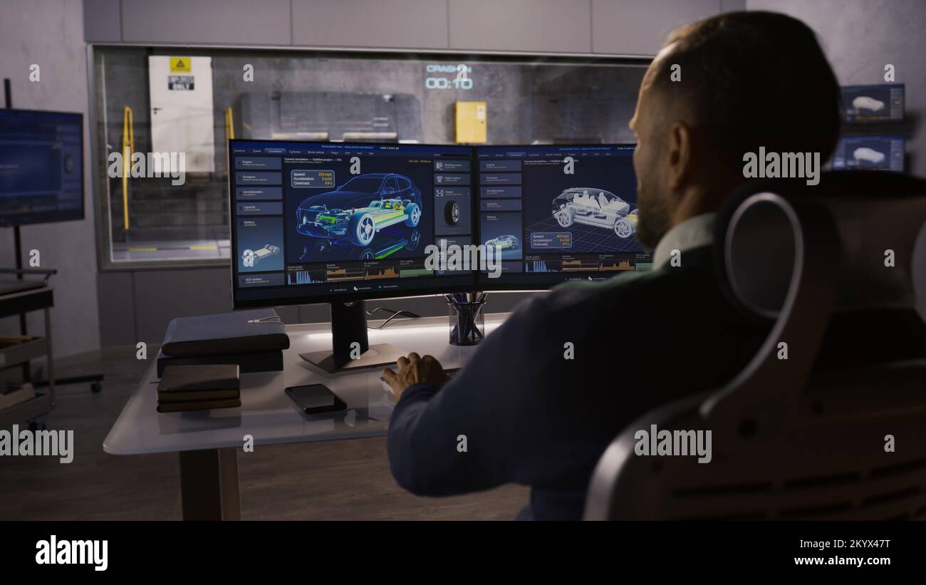 An Engineer In A Crash Test Lab Uses A Car Crash Test System To