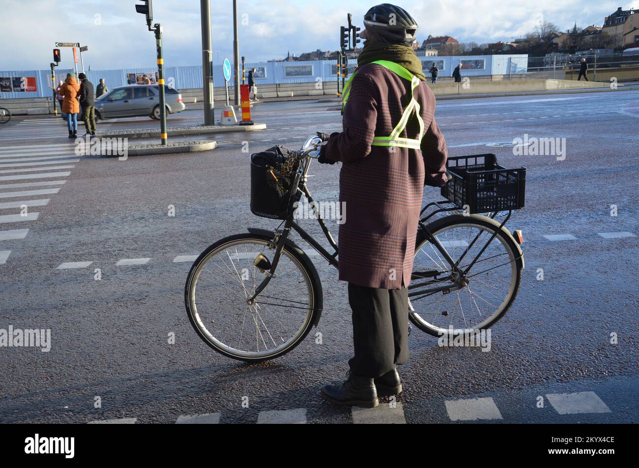 Stockholm, Sweden - November, 2022 - Woman with bicycle at Munkbroleden ...