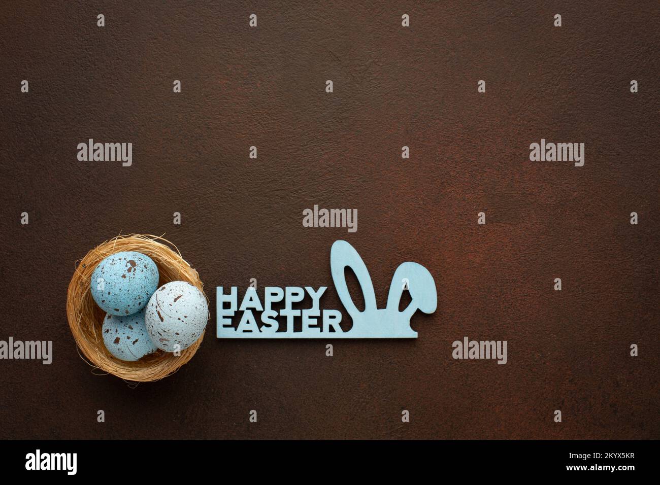 Easter greeting card with colorful eggs. Top view on stone table with ...