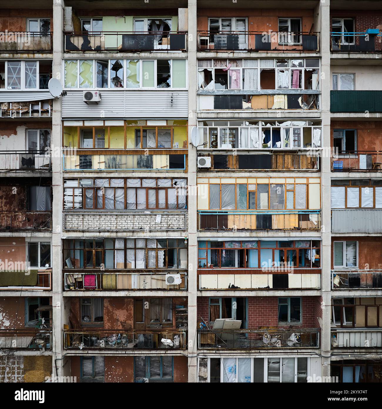 An apartment building in a war zone. Damage to a house as a result of ...