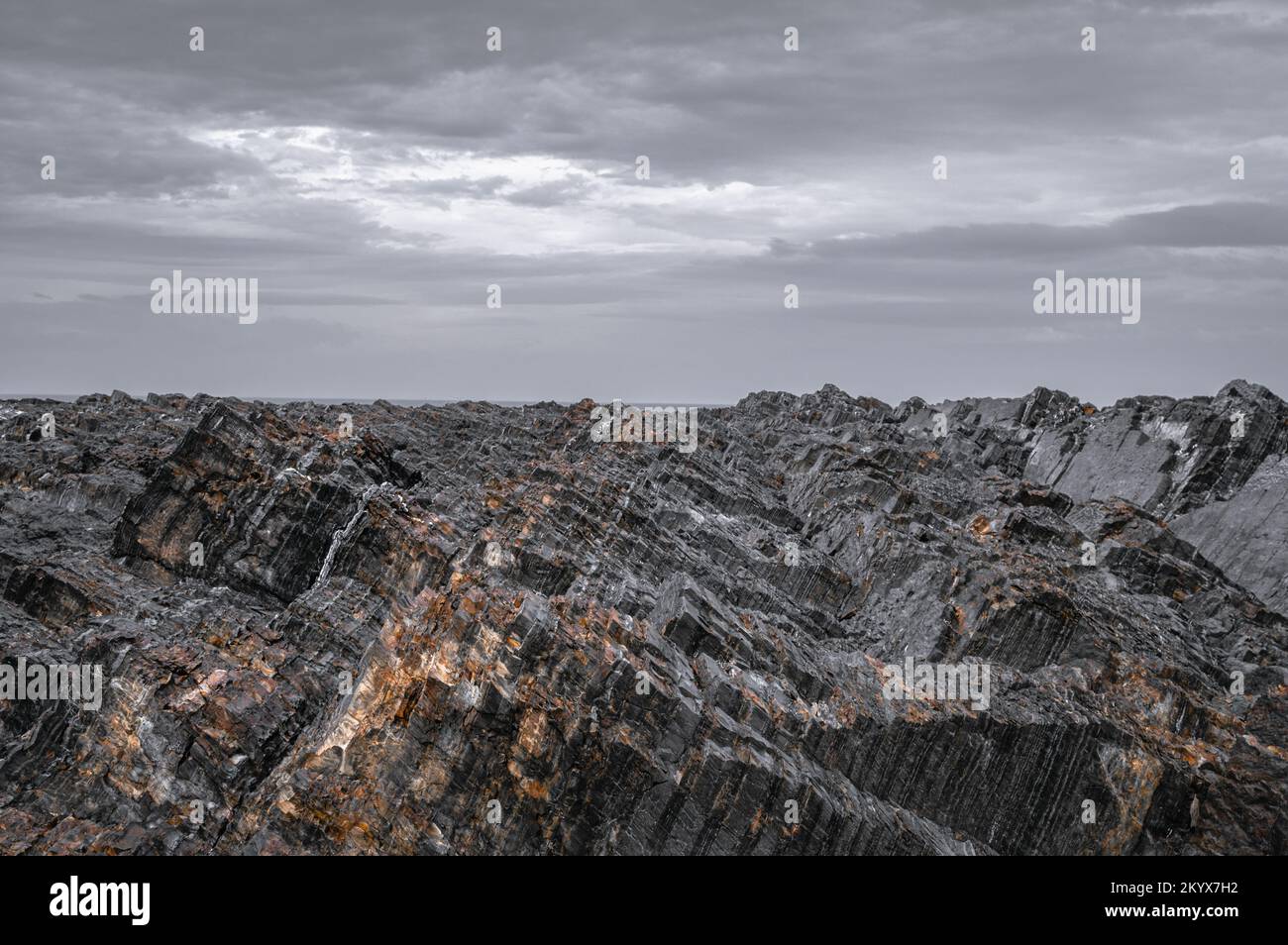 Divide between the rocks and gloomy skies. Kekurskiy Cape. Rybachy ...