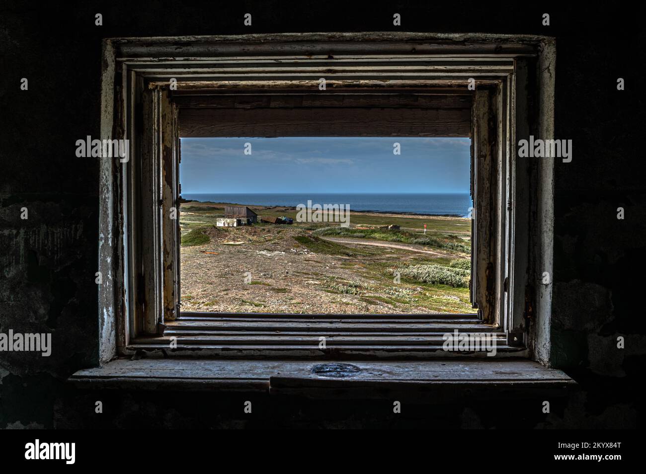 Scenic view from a window of the abandoned house. Rybachy Peninsula ...