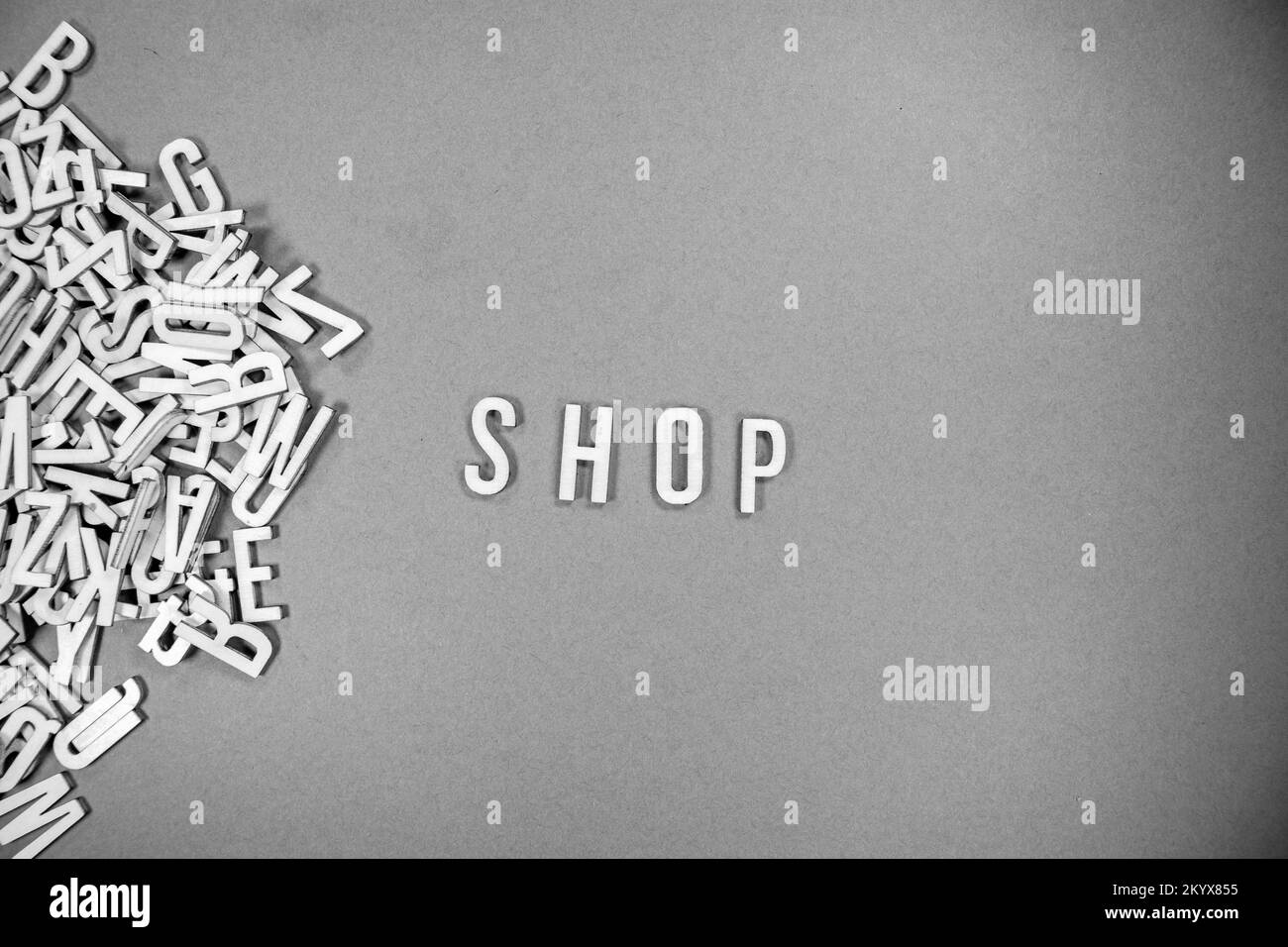 background with a pile of wooden capital letters spilling into words ...