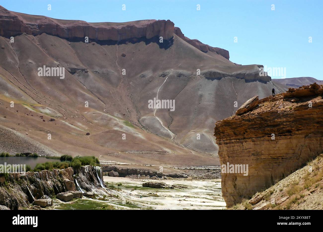 Band-e Amir lakes near Bamyan (Bamiyan) in Central Afghanistan. A person on a viewpoint ...