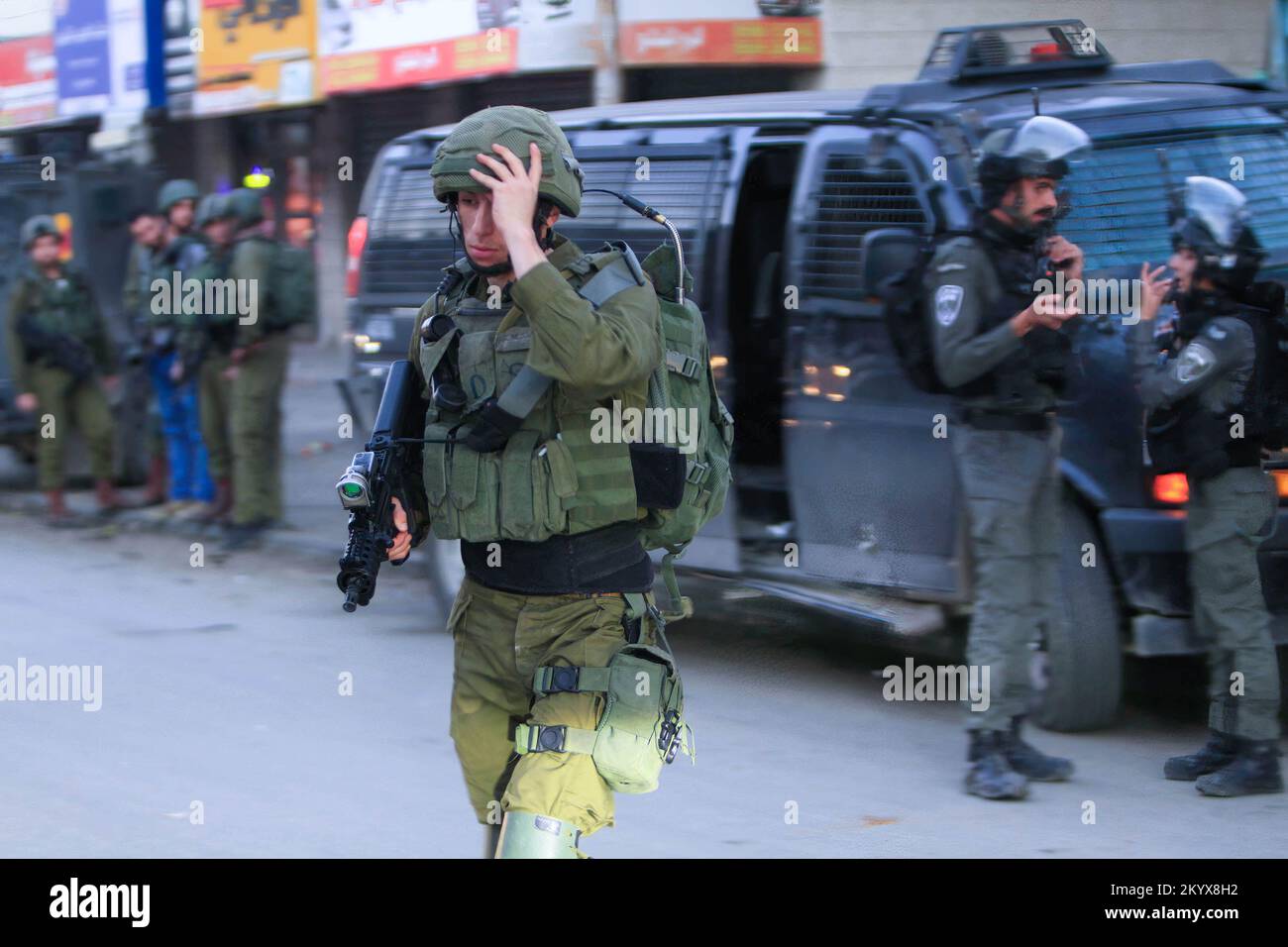Israeli soldiers securing the area moments after an Israeli soldier ...