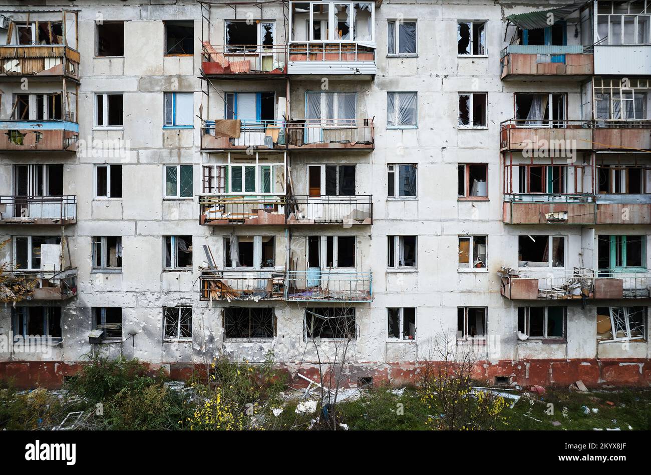 An apartment building in a war zone. Damage to a house as a result of ...